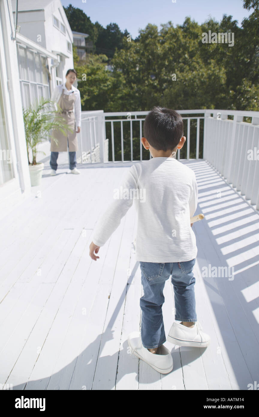 Boy walking on terrace Stock Photo - Alamy