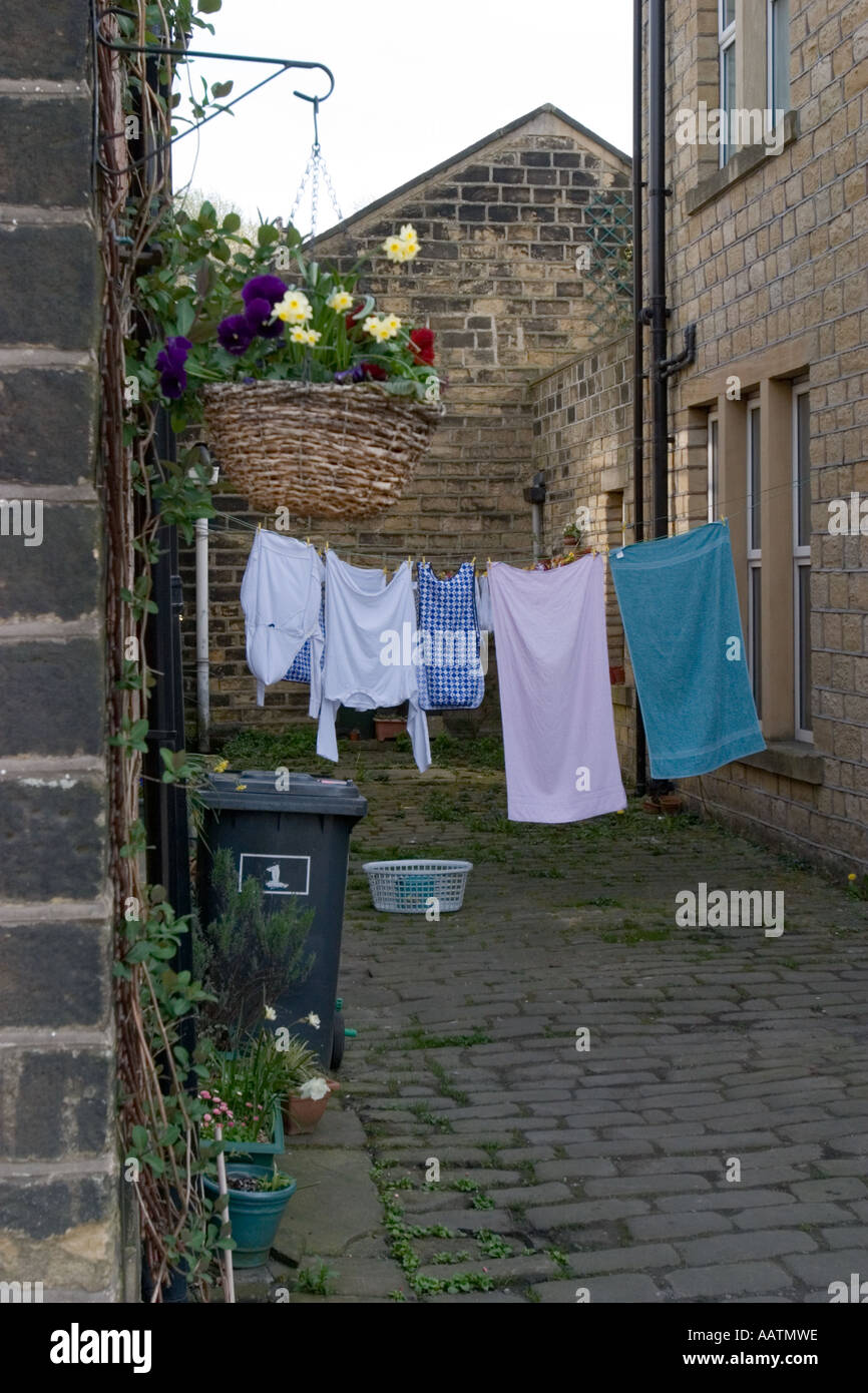 Washing hung out in cobbled street Slaithwaite Stock Photo - Alamy