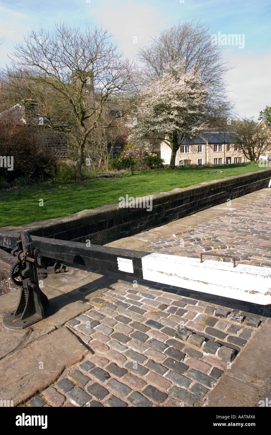 Canal lock in centre of Slaithwaite looking towards church Stock Photo ...