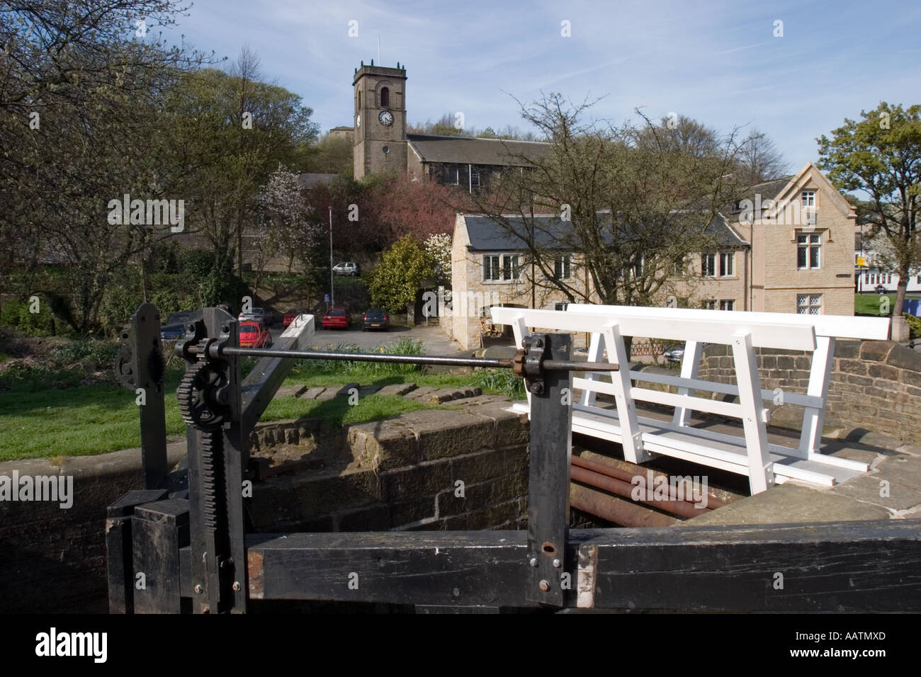 Canal lock in centre of Slaithwaite looking towards church Stock Photo ...