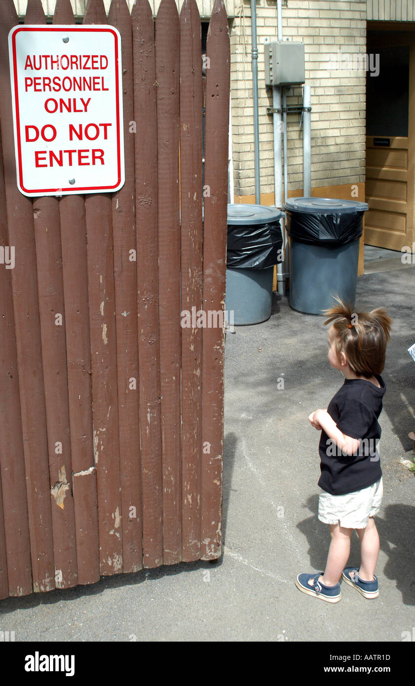 Child disregards posted sign Stock Photo - Alamy