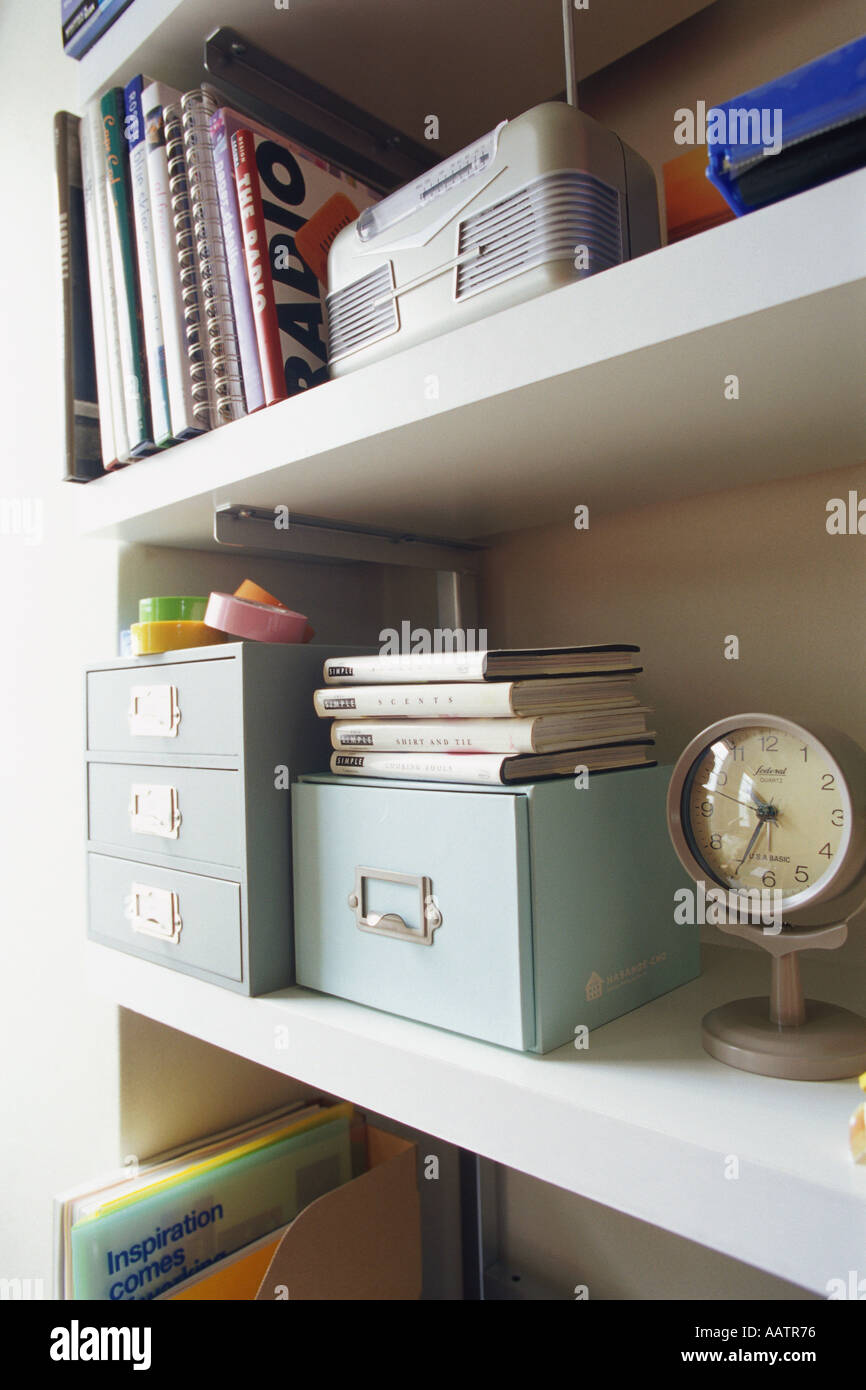 Clock on shelf Stock Photo - Alamy