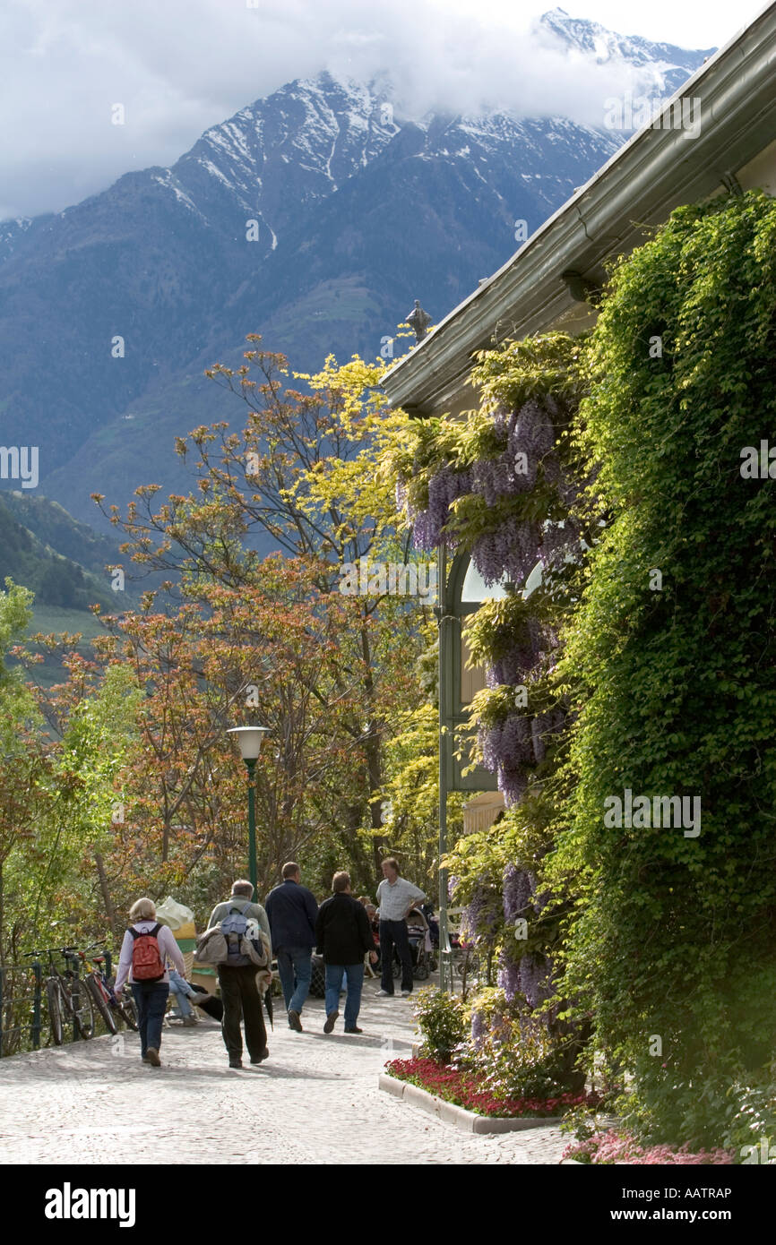 Walking the Winter Promenade alongside the river Passirio in Merano ...
