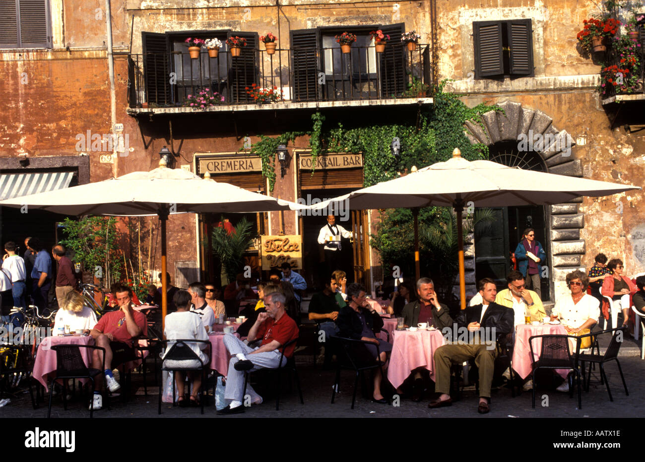 Waiter in outdoor terrace pavement bar cafe Piazza Navona is a city ...