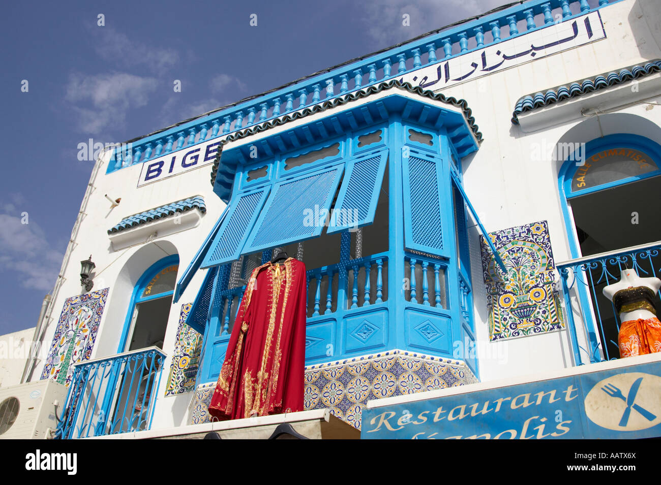 traditional blue painted window shutters above market shop in nabeul tunisia Stock Photo - Alamy
