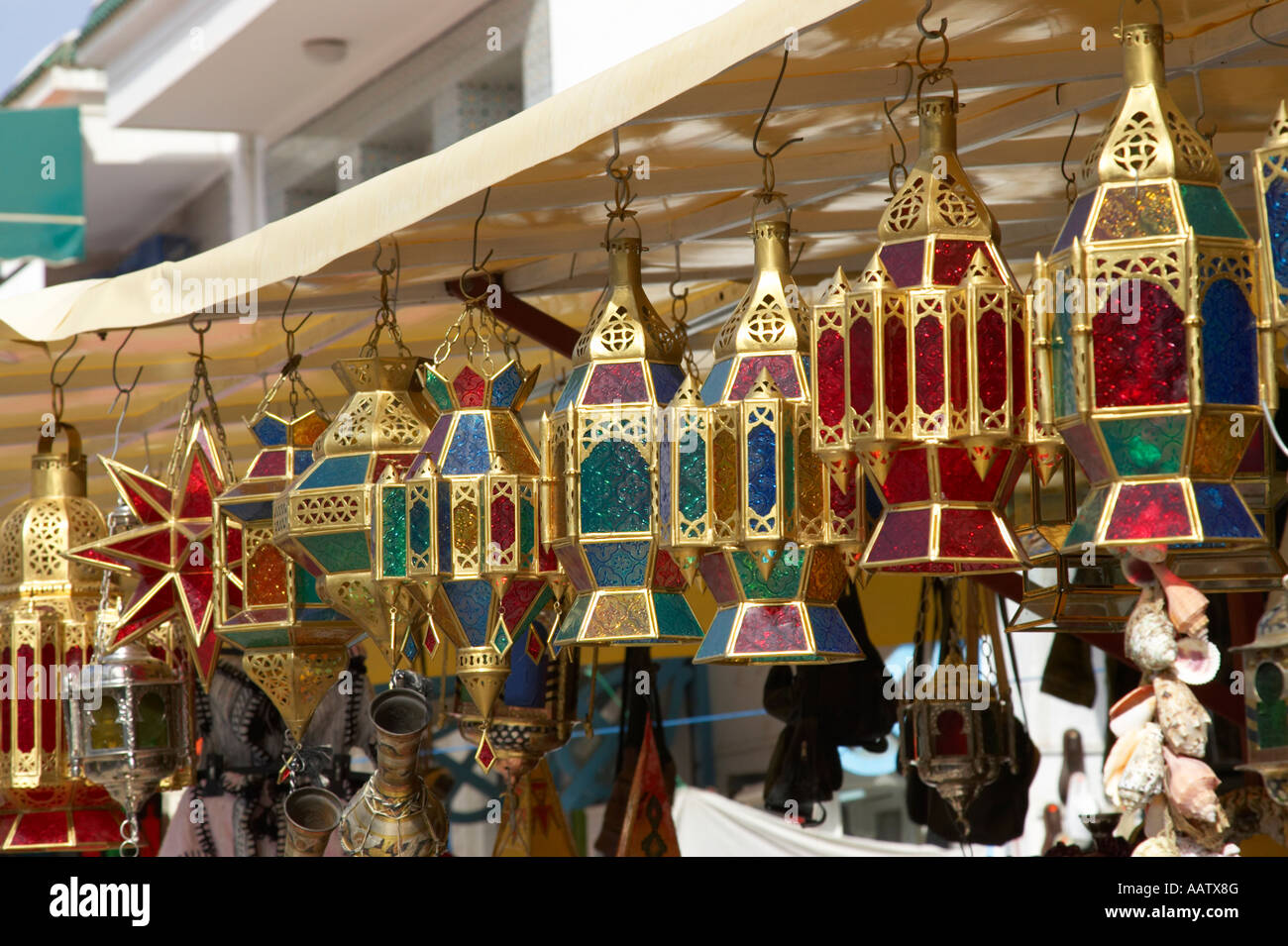 brightly coloured polished gold and red blue and green glass lanterns ...