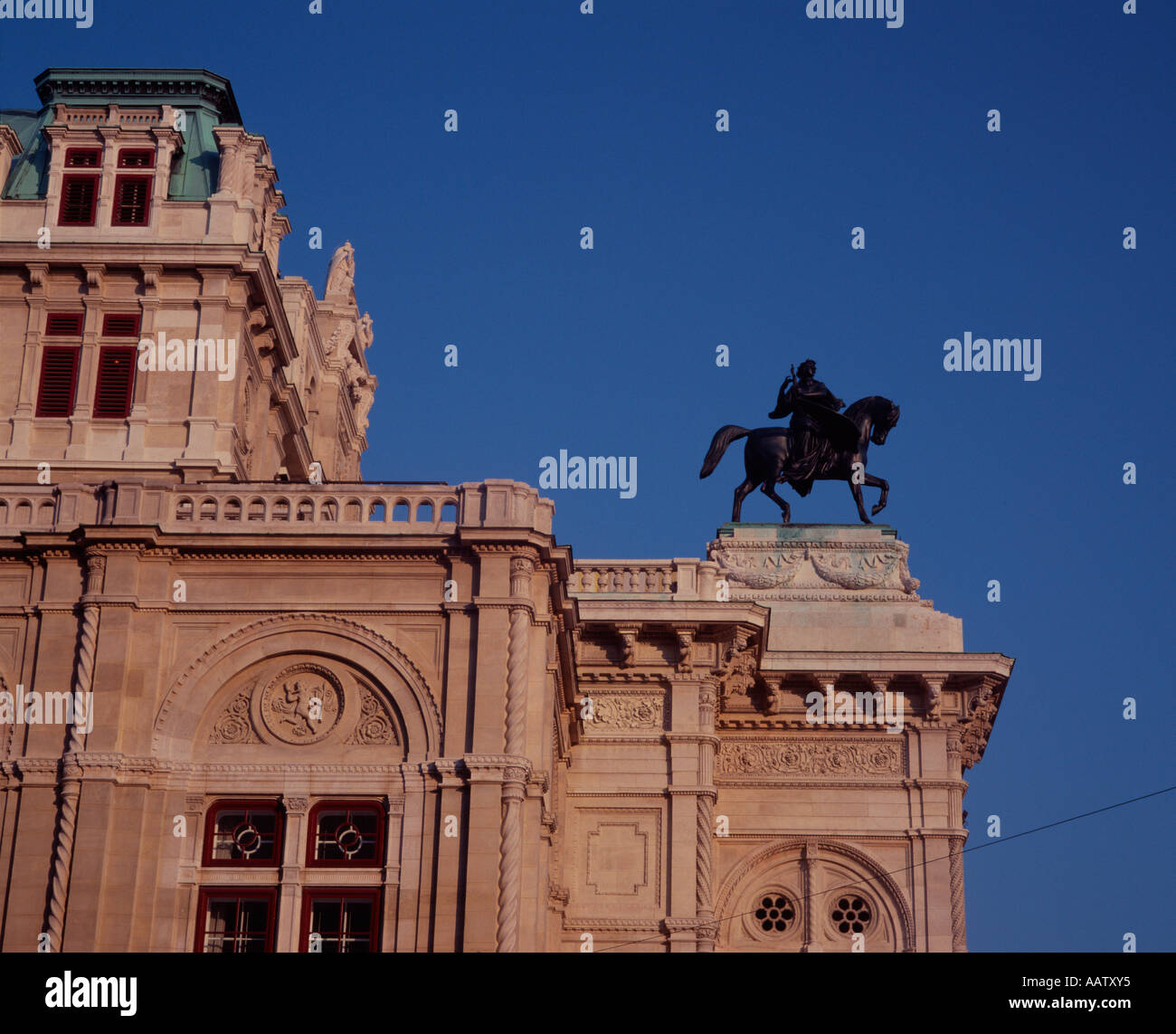 Statue of a man on a horse on the roof of the State Opera House on the ...