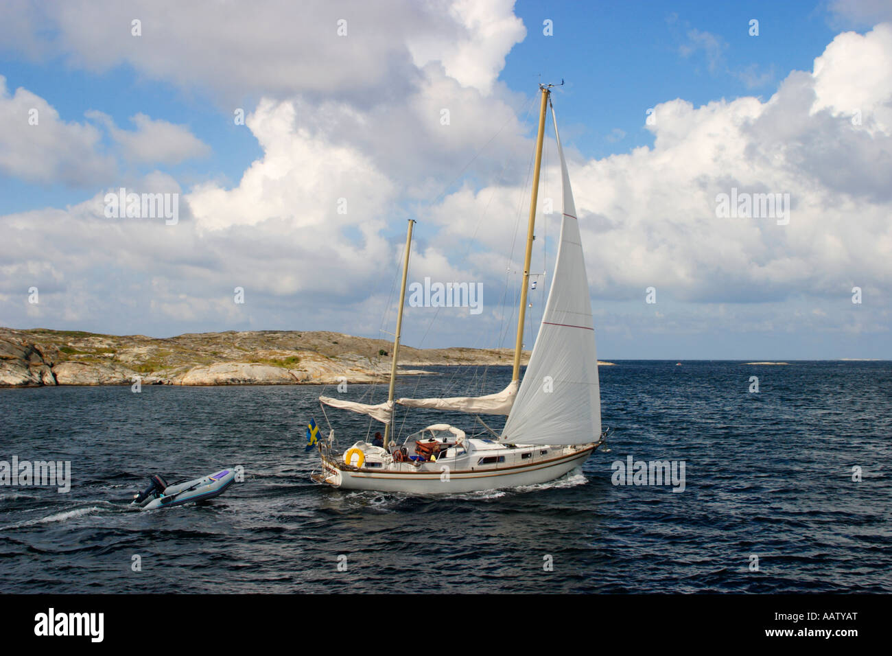 Sailing boat at the coastline Stock Photo - Alamy