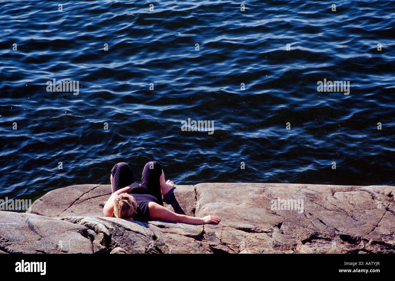 The woman sunbathe in the sun Stock Photo - Alamy