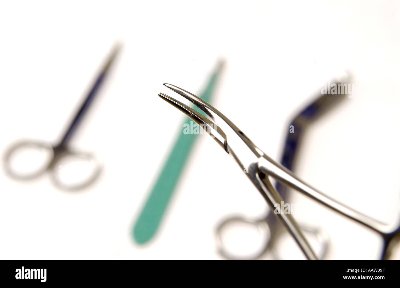 Scalpel and forceps Stock Photo - Alamy