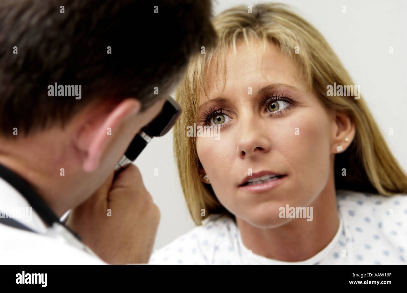 Physician examining patient Stock Photo - Alamy