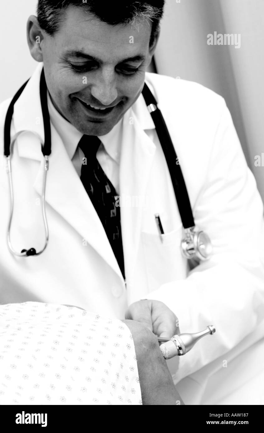 Physician examining patient Stock Photo - Alamy