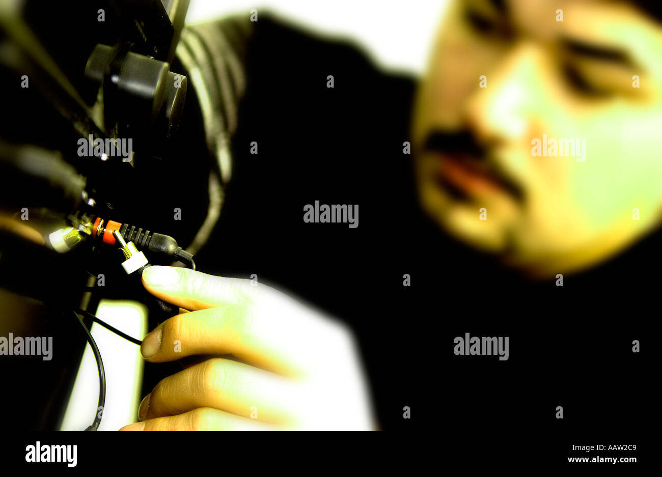 Man fixing stereo Stock Photo - Alamy