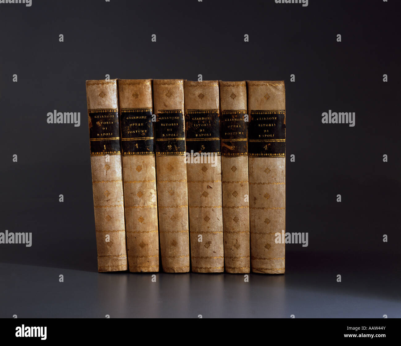 row of six antique books Stock Photo - Alamy