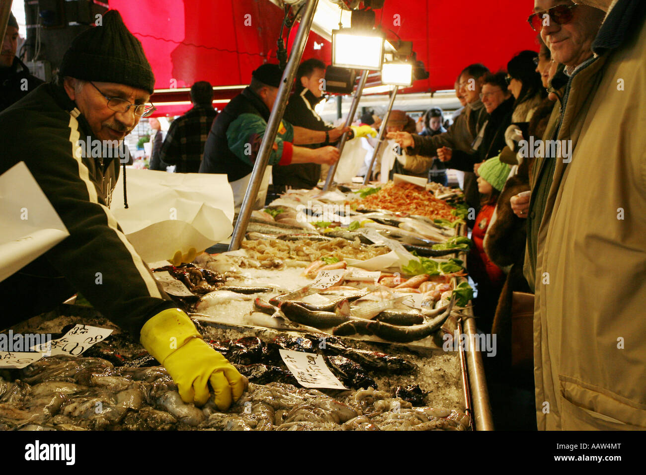 Man at the fish market stand, Venice, Italy Stock Photo - Alamy