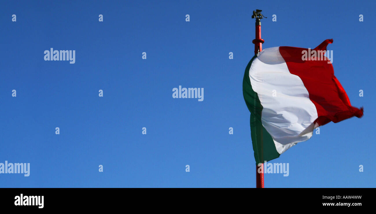 Italian flag flying with blue sky background Stock Photo - Alamy