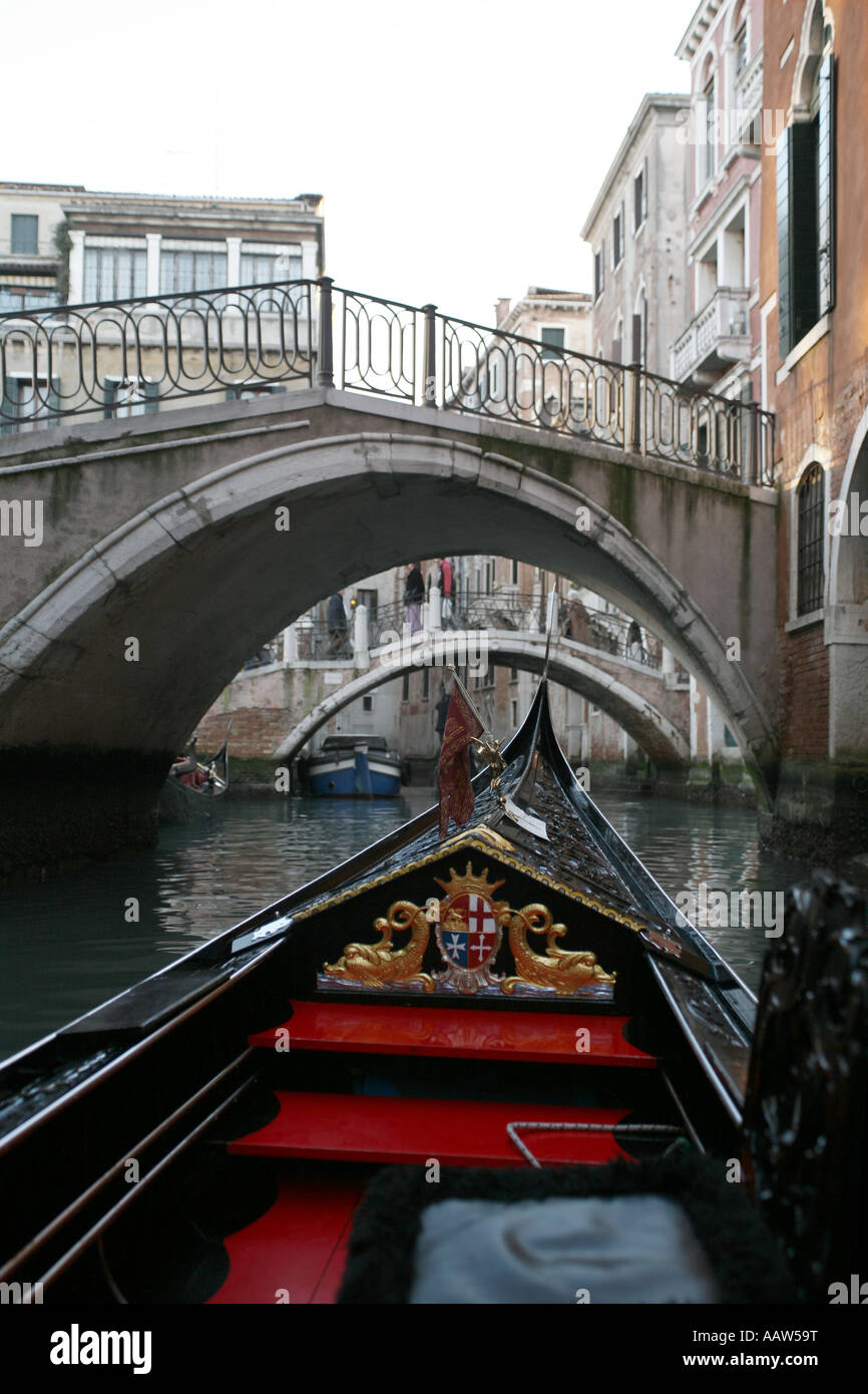 Gondola going under bridges, Venice, Italy Stock Photo - Alamy