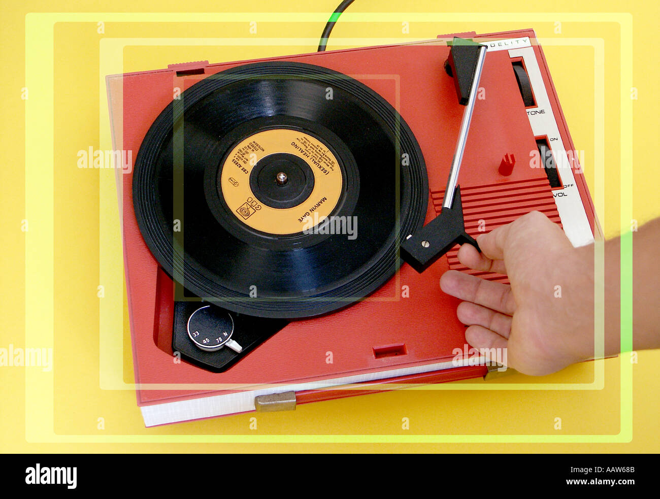 retro red record player with hand putting record on Stock Photo - Alamy