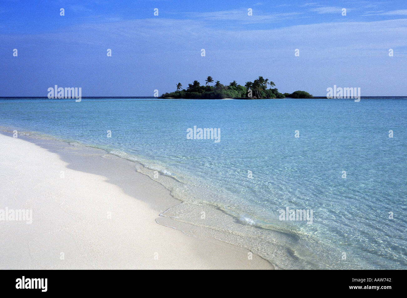 sandy beach with small desert island in the distance Stock Photo - Alamy