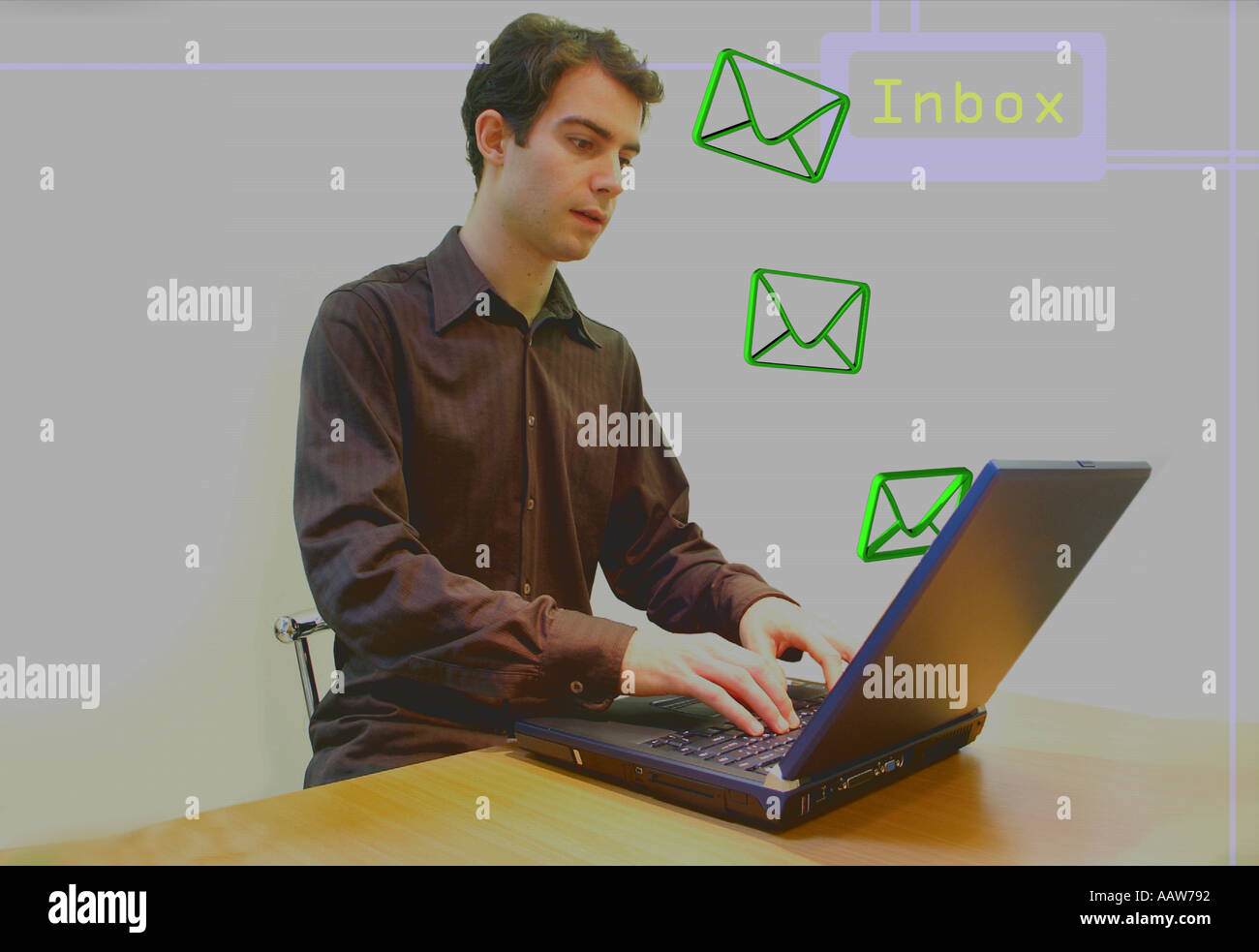 email envelopes fly out of a laptop as a young man types Stock Photo ...