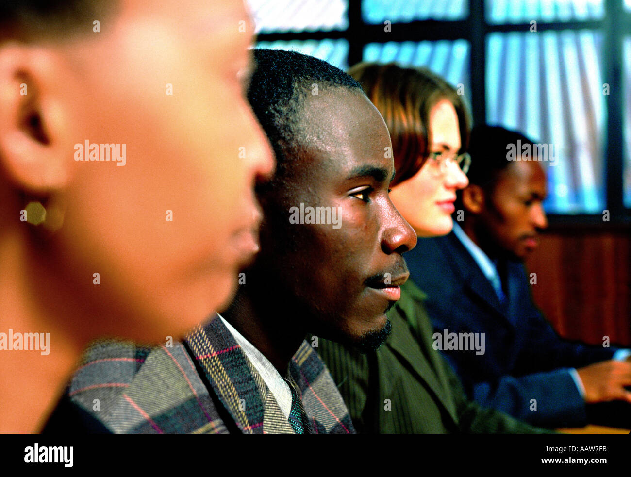 Multi ethnic business discussion in boardroom Johannesburg Gauteng ...