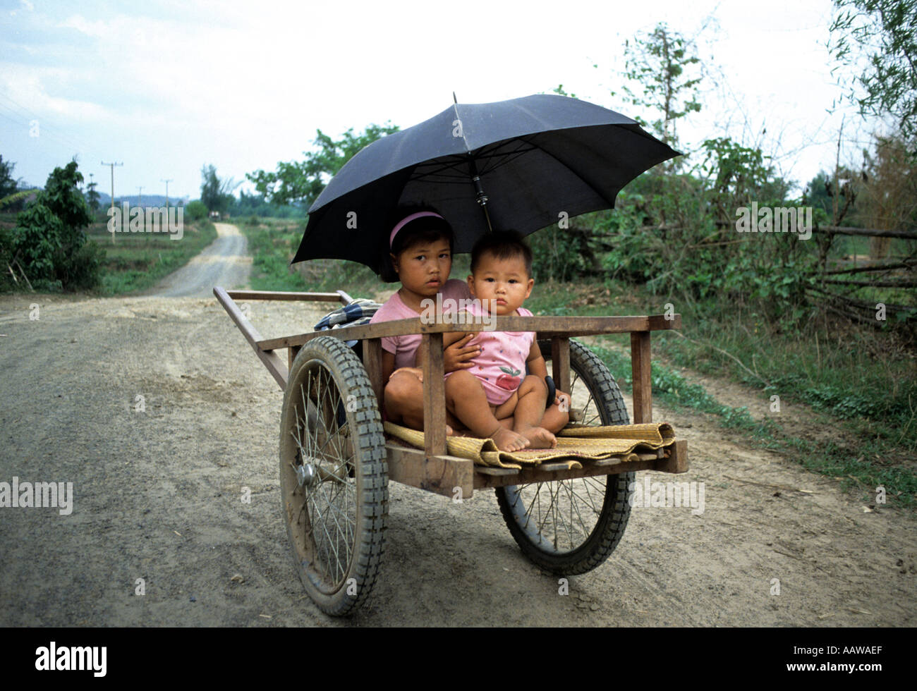 Children in cart hi-res stock photography and images - Alamy