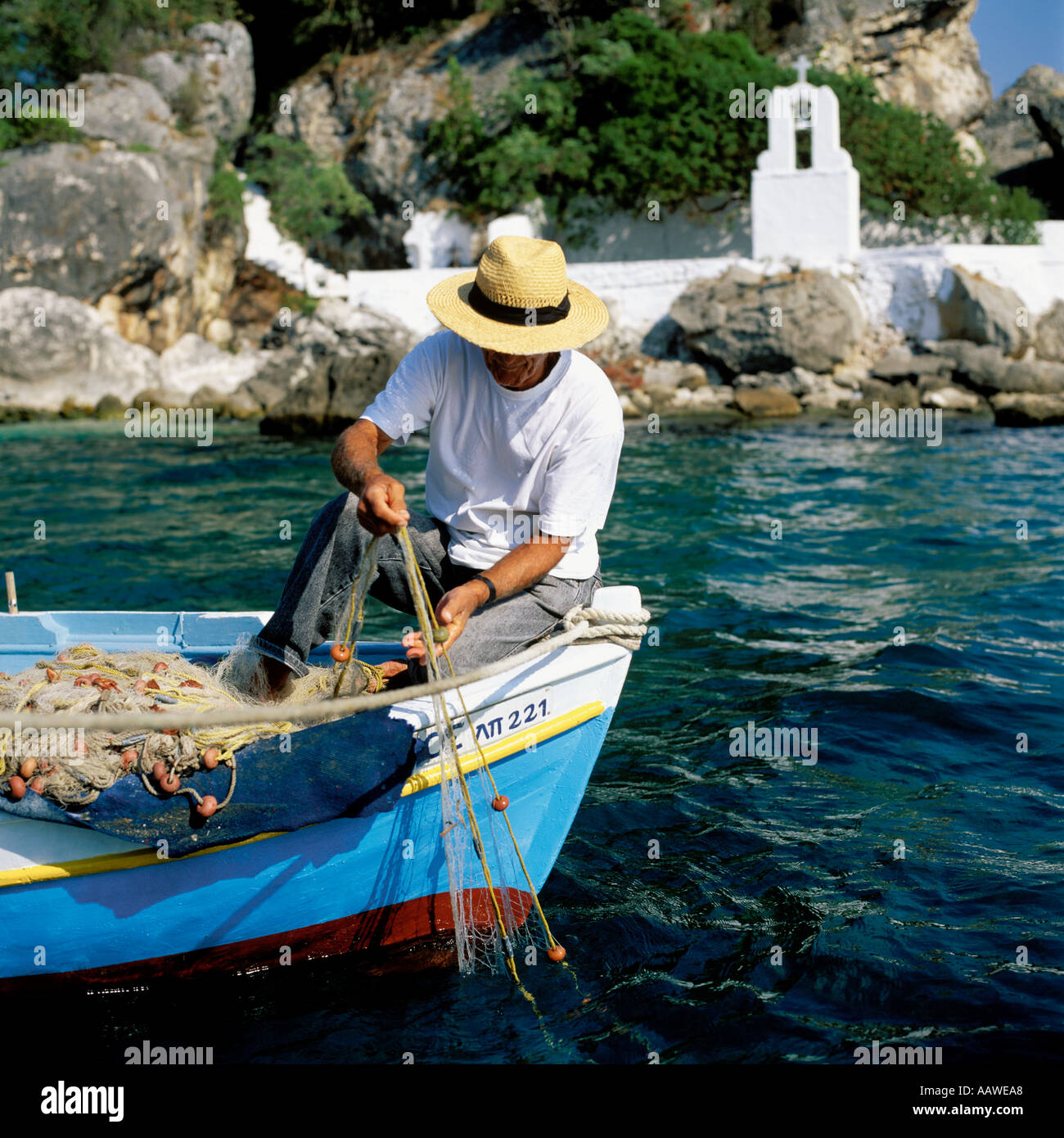 GREEK FISHERMAN FISHING IN PARGA Stock Photo - Alamy