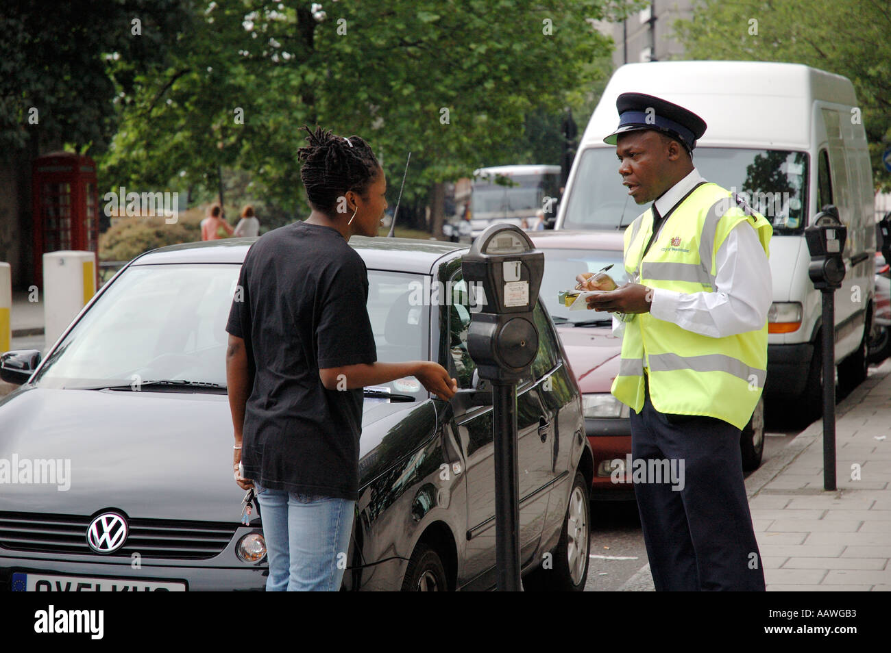 driver getting parking ticket on meter Stock Photo - Alamy