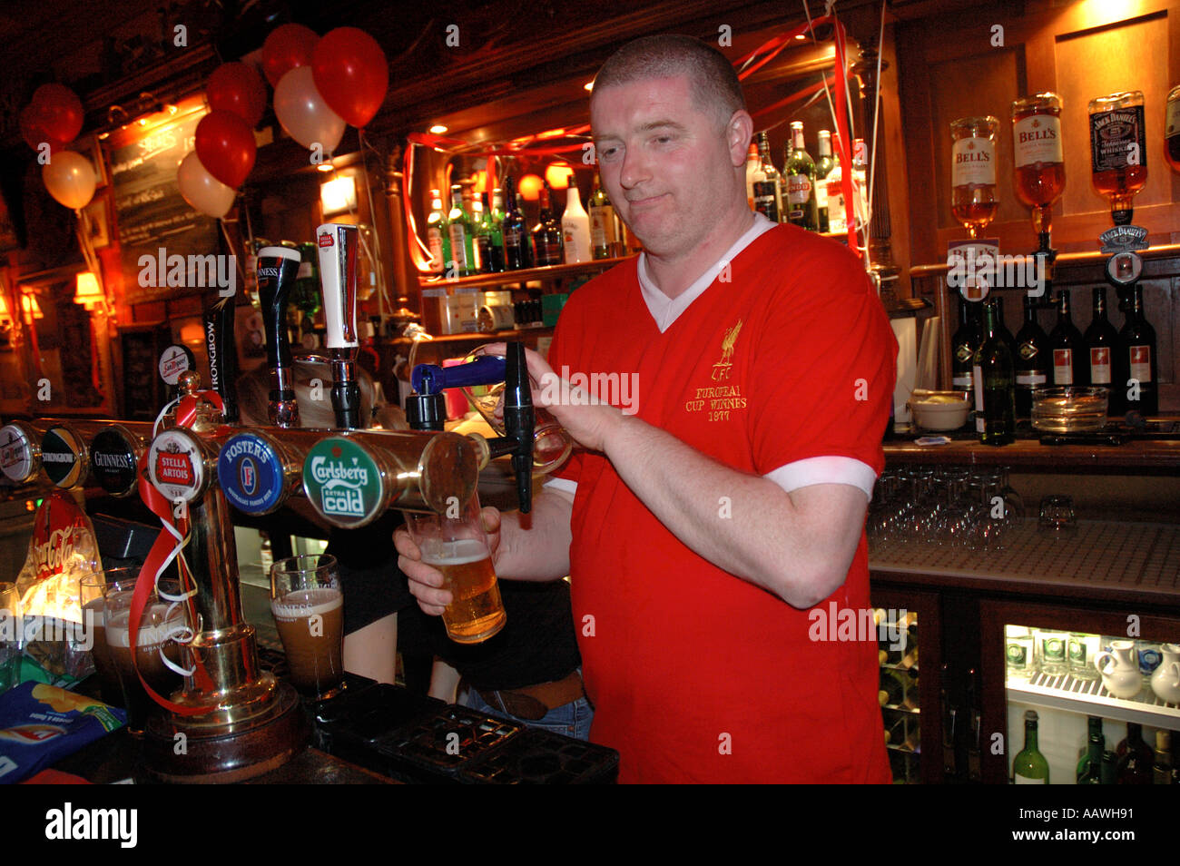 Group of Liverpool supporters watching football match in local pub They ...