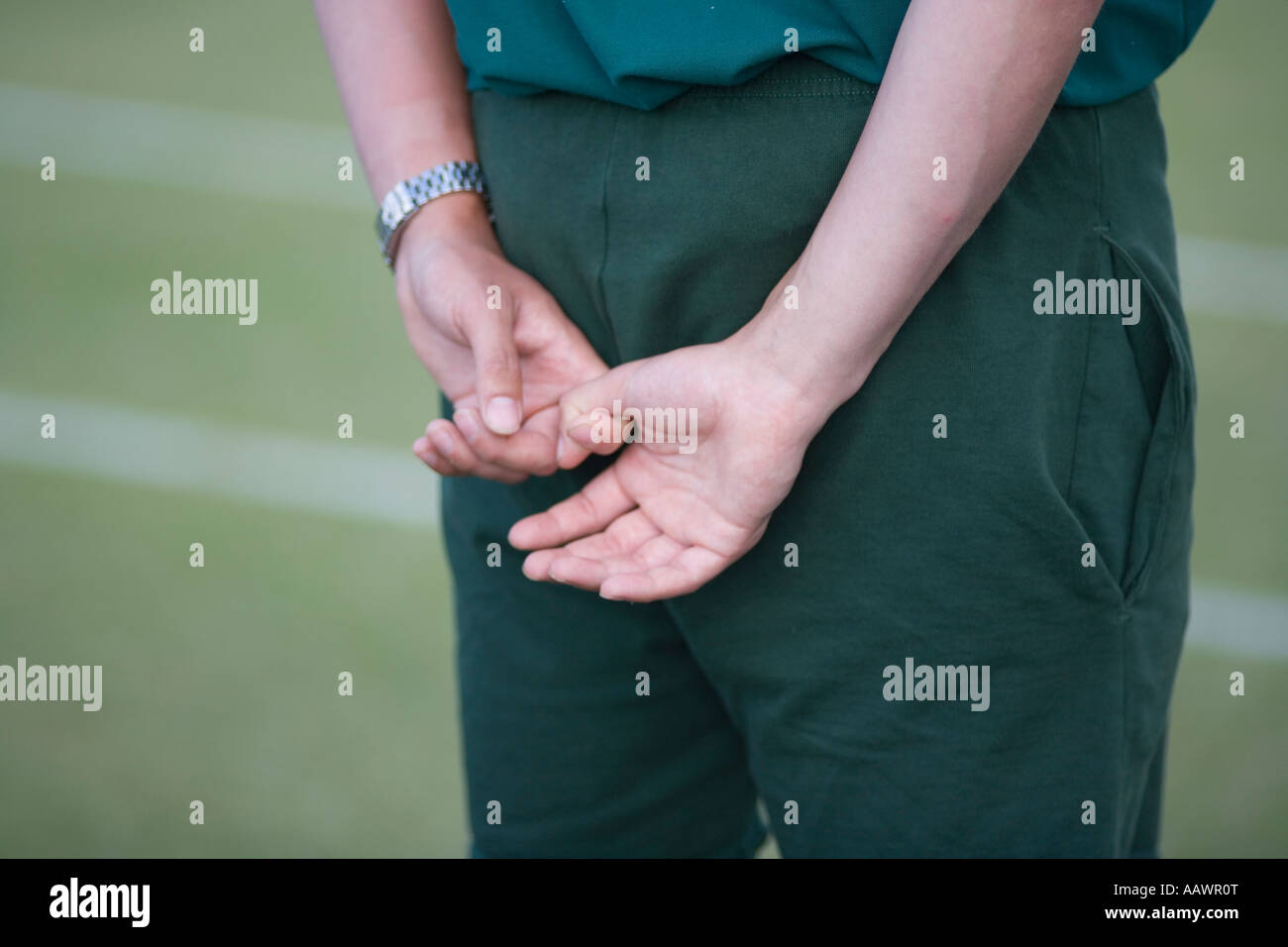 Hands clasped behind back hi-res stock photography and images - Alamy