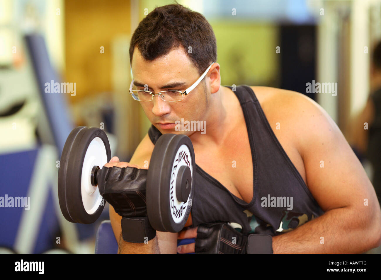 Man lifts a dumbell Stock Photo - Alamy
