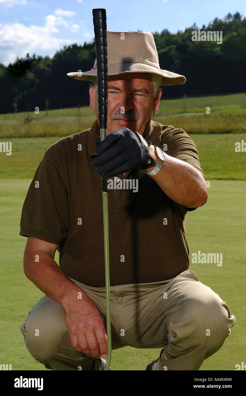 64 year old man playing golf Stock Photo - Alamy
