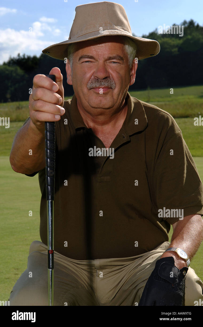 64 year old man playing golf Stock Photo - Alamy