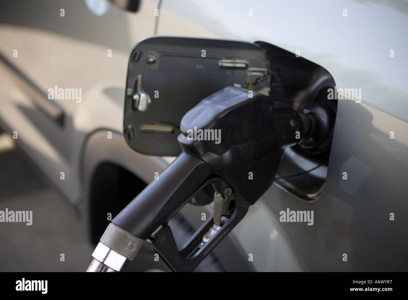 Gas nozzle in a gas tank Stock Photo - Alamy