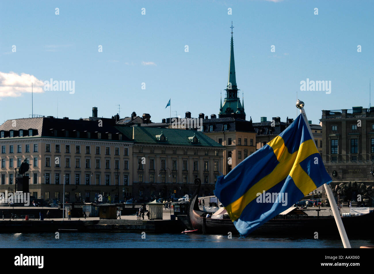 Swedish flag flying on the back of a ferry with the Royal Palace in the ...