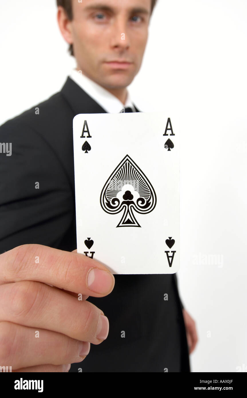 magician holding up the ace of spades Stock Photo - Alamy