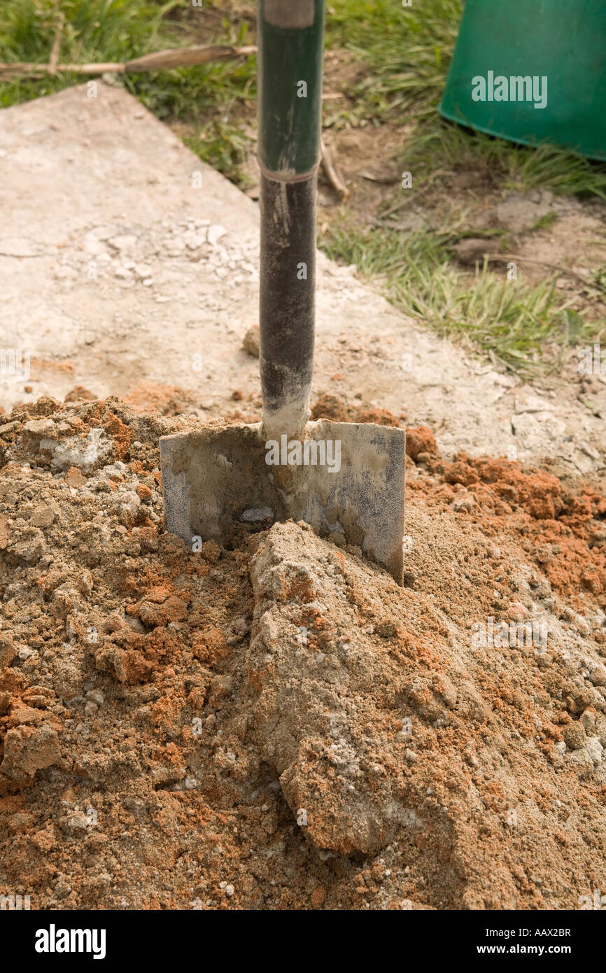 Mixing sand and cement to create mortar Stock Photo - Alamy