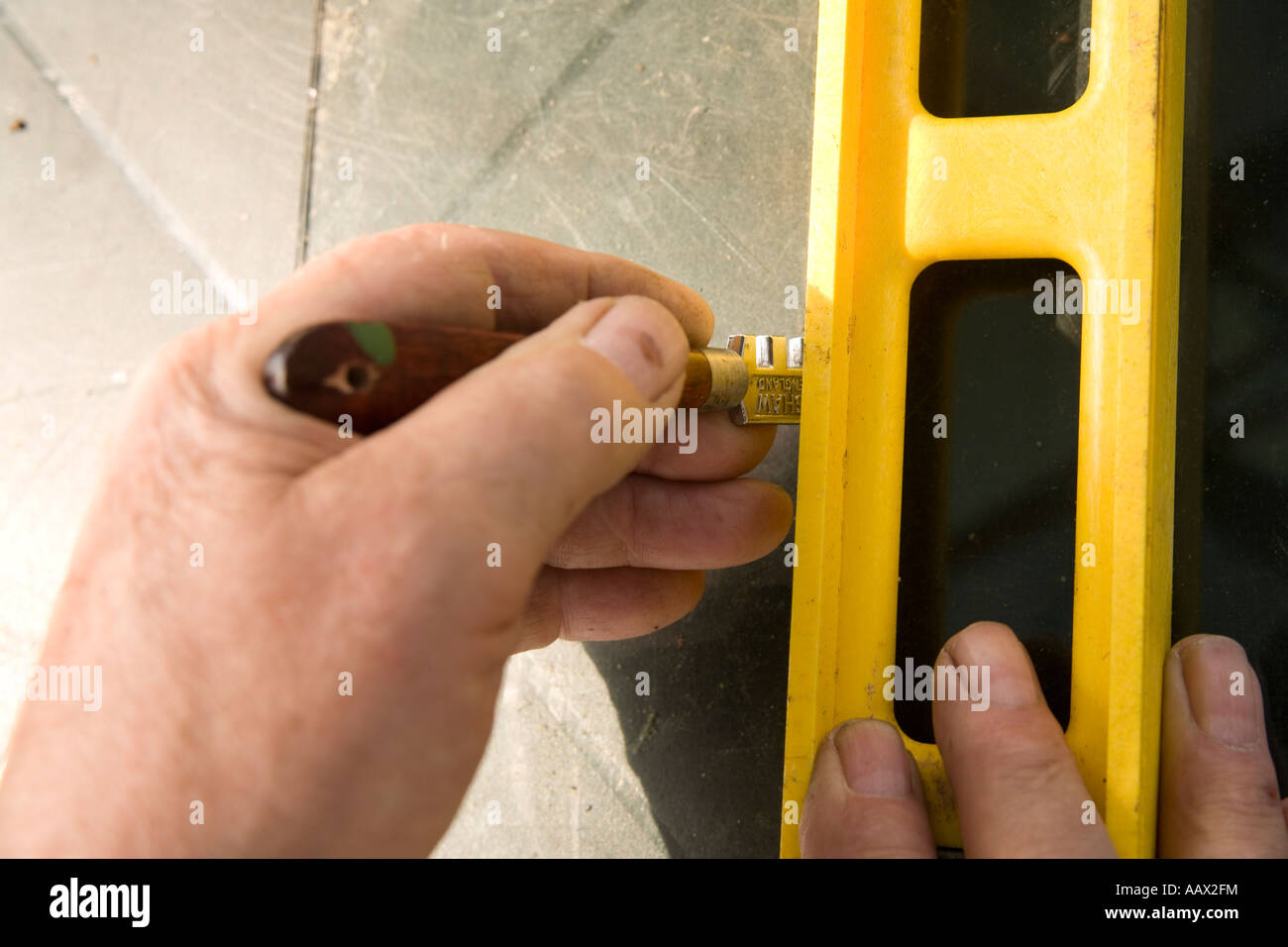 Cutting glass with a straight edge Stock Photo - Alamy