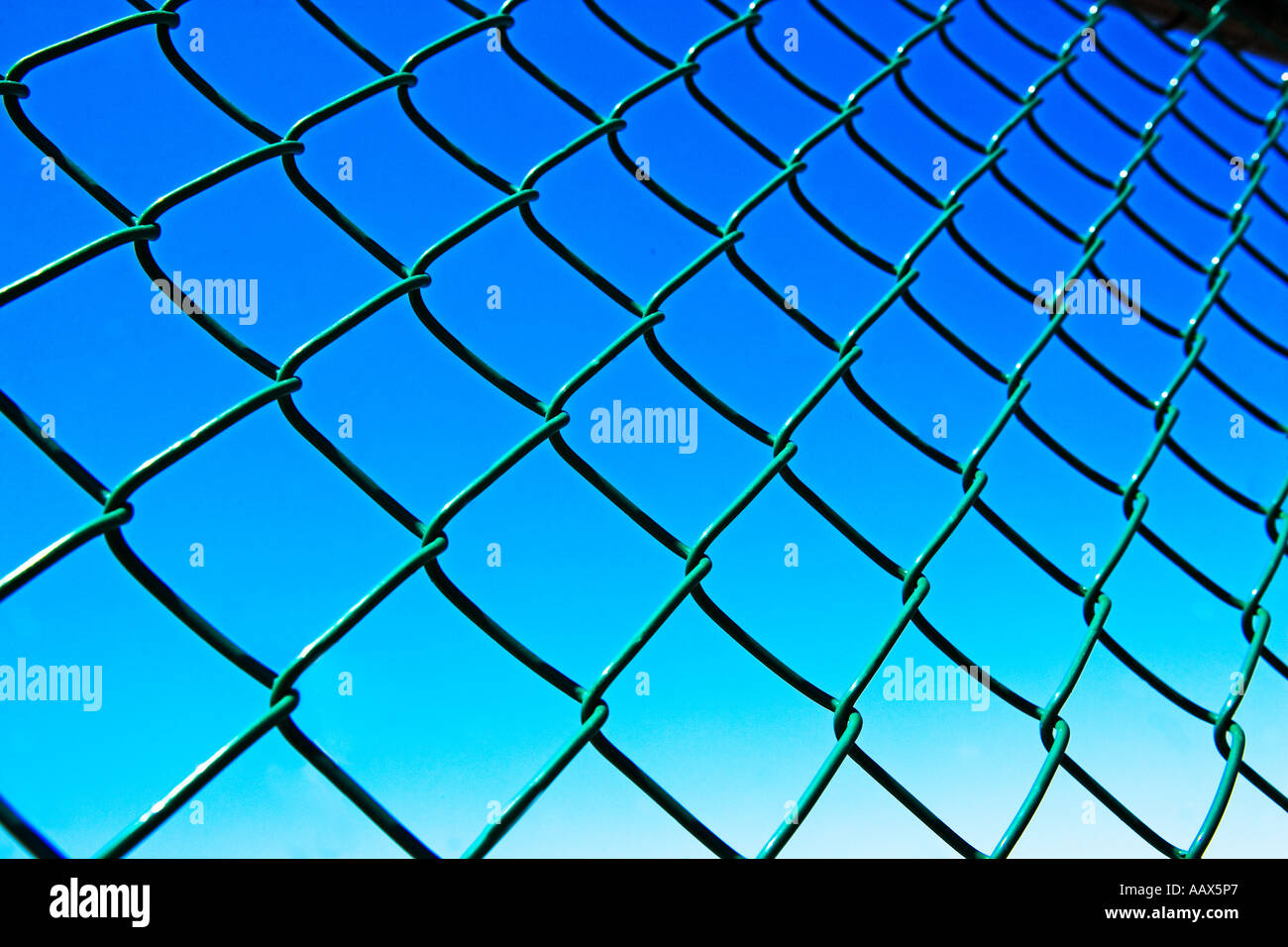 CHAIN LINK FENCE WITH BLUE SKY Stock Photo - Alamy