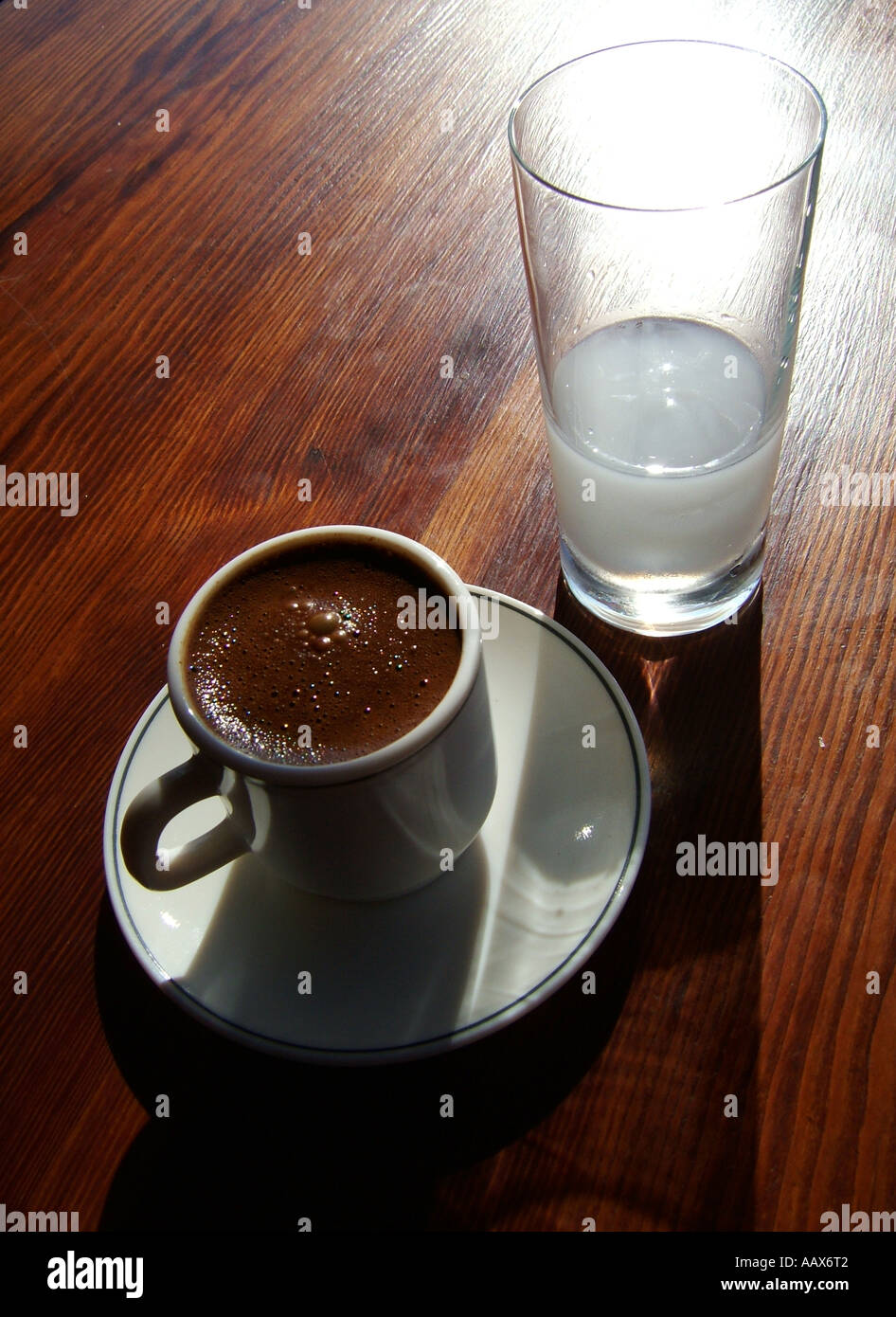 glass of ouzo with coffee Stock Photo - Alamy