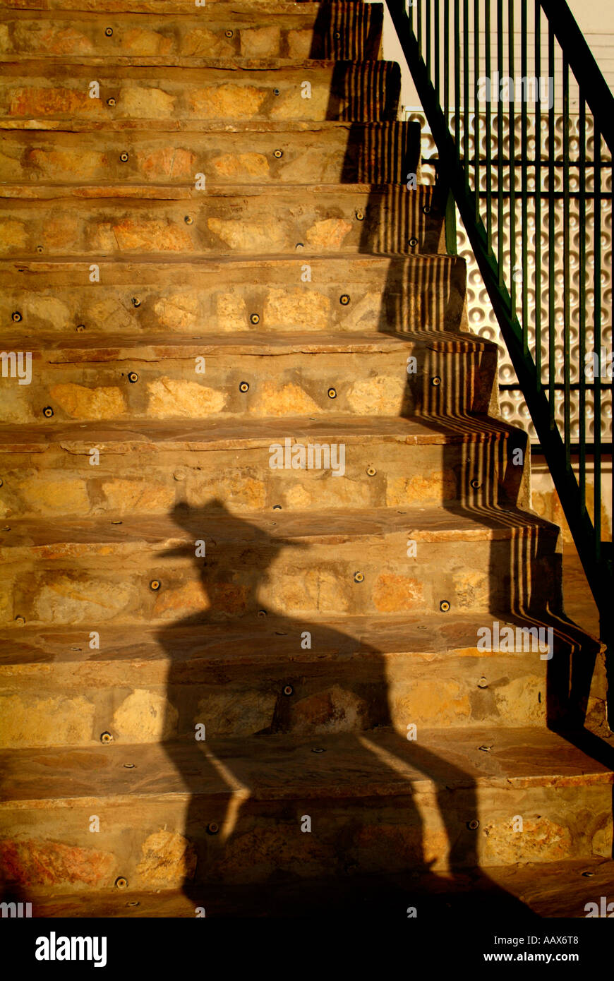 shadow of person with hat on steps Stock Photo - Alamy