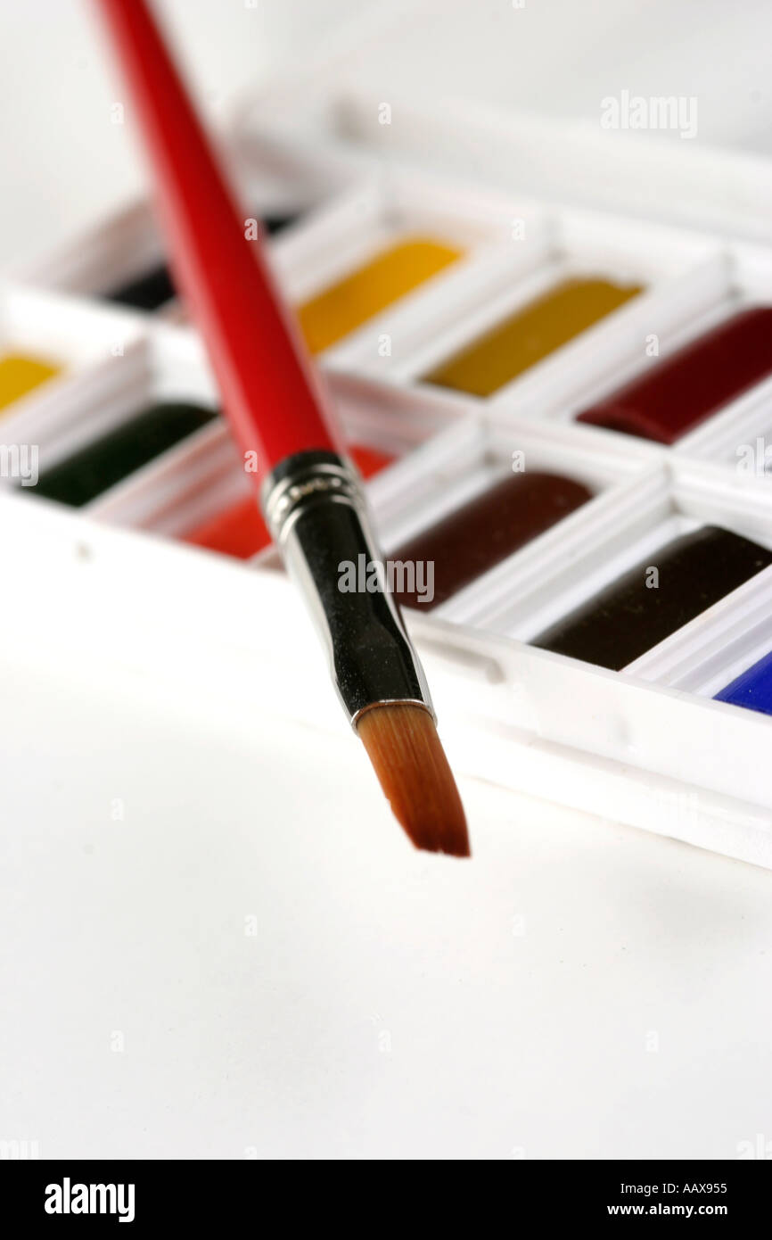 Brush and box of paints on a white background Stock Photo - Alamy