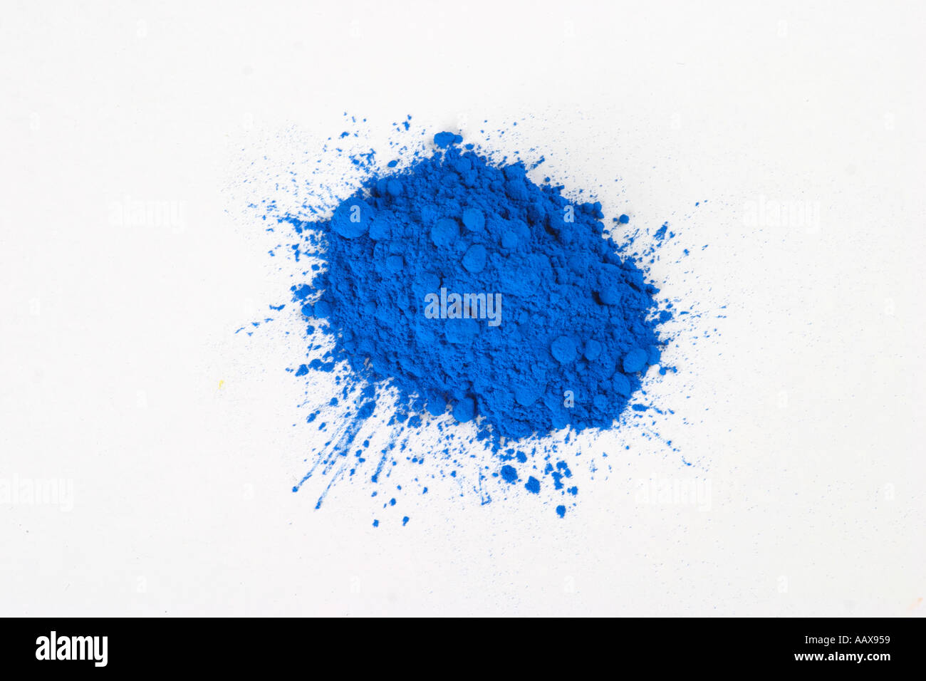 pile of blue powder paint on a white background Stock Photo - Alamy