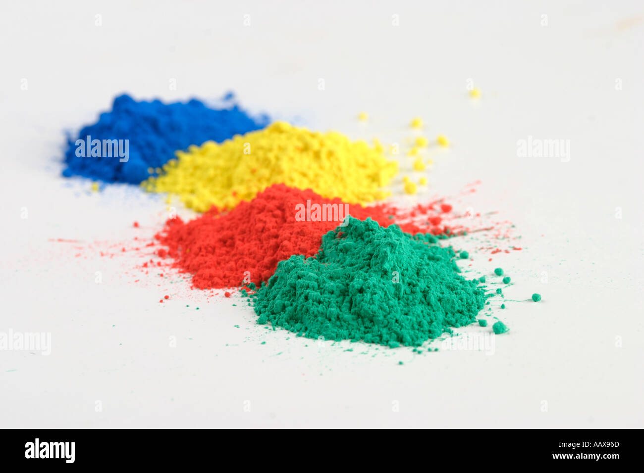 four piles of red green yellow and blue paint powder Stock Photo - Alamy
