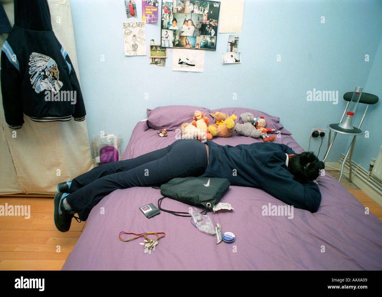 depressed and upset teenaged girl lying on the bed crying Stock Photo ...