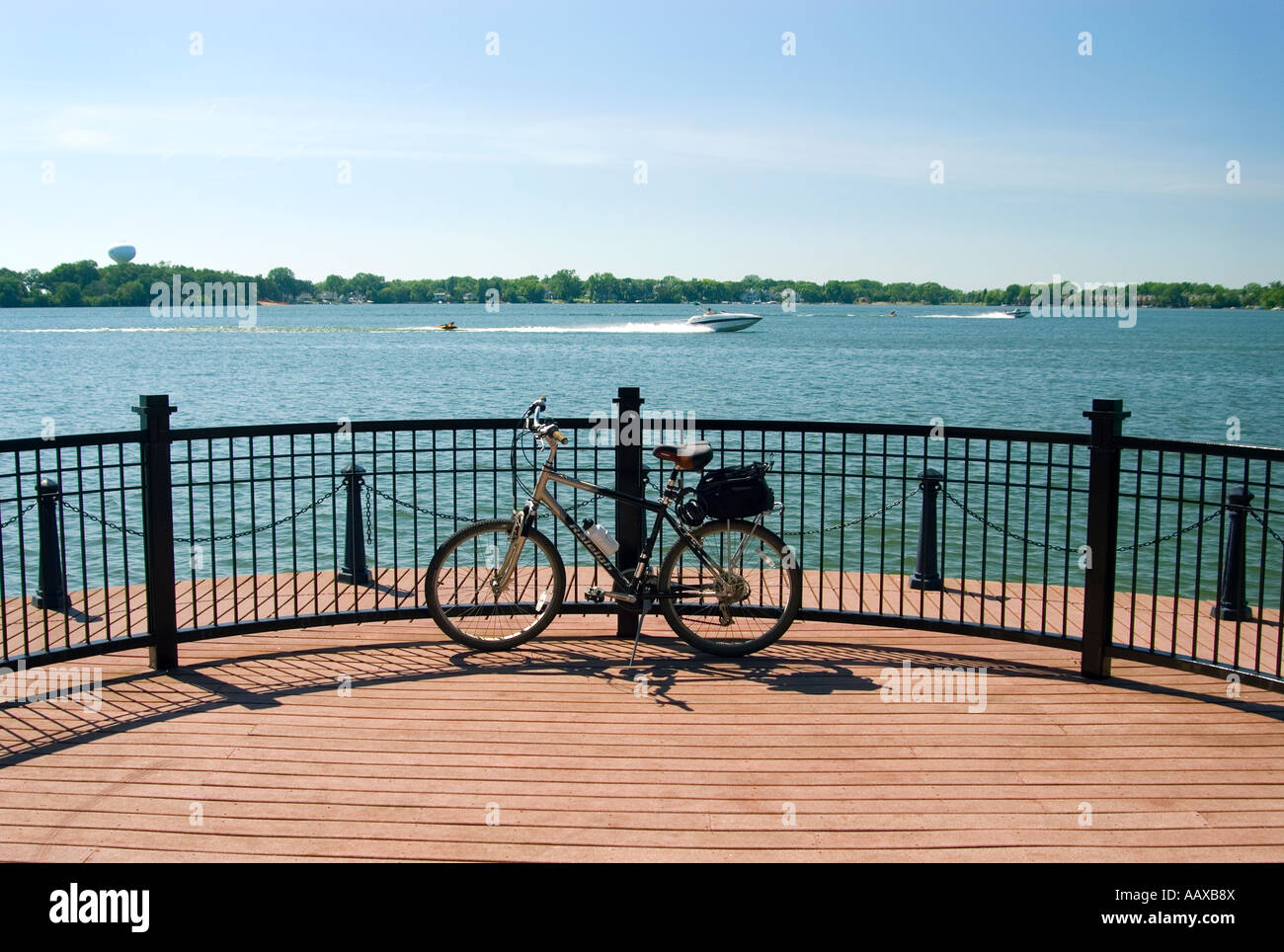 Bicycle parked at lakeside promenade Stock Photo - Alamy