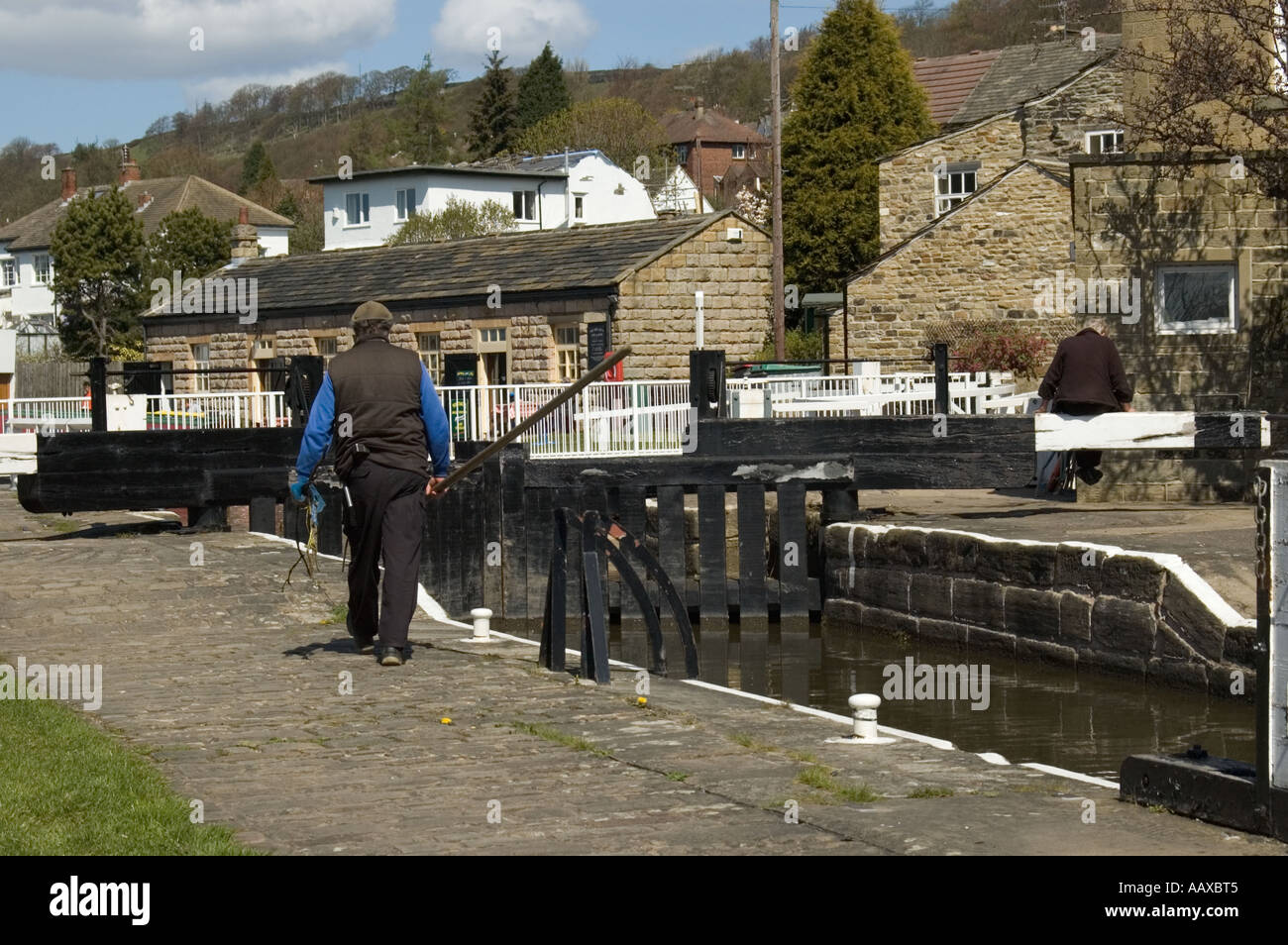 Lock keeper working on the Five Rise locks on the Leeds Liverpool Canal ...