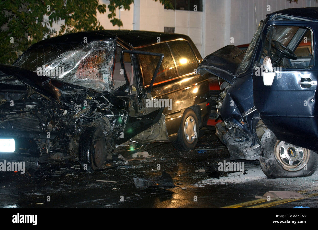 two cars autos crashed in a head on collision Stock Photo - Alamy