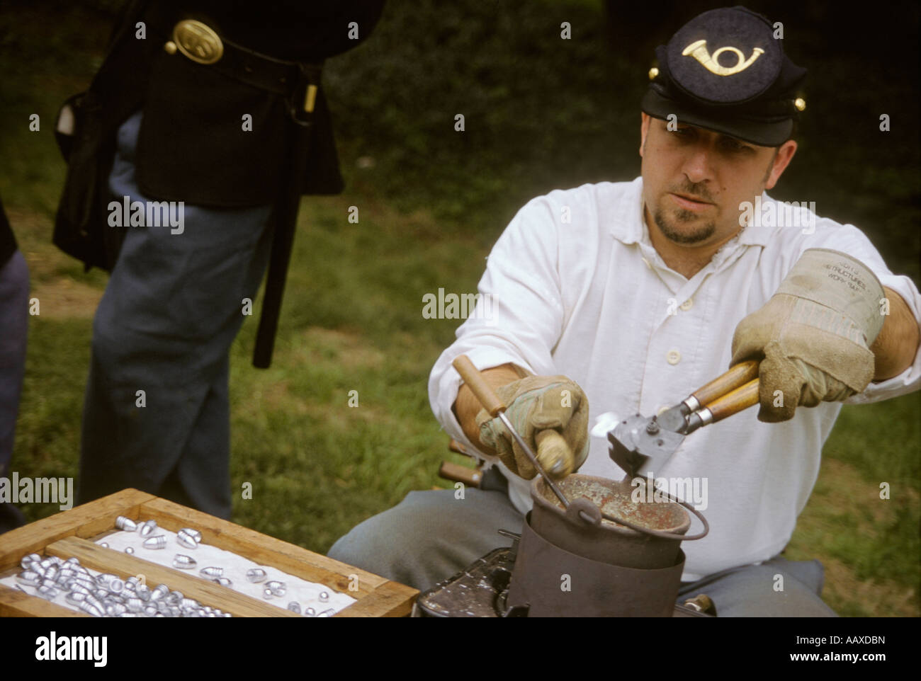 Civil war reenactor Lancaster PA Pennsylvania USA pouring lead bullets ...