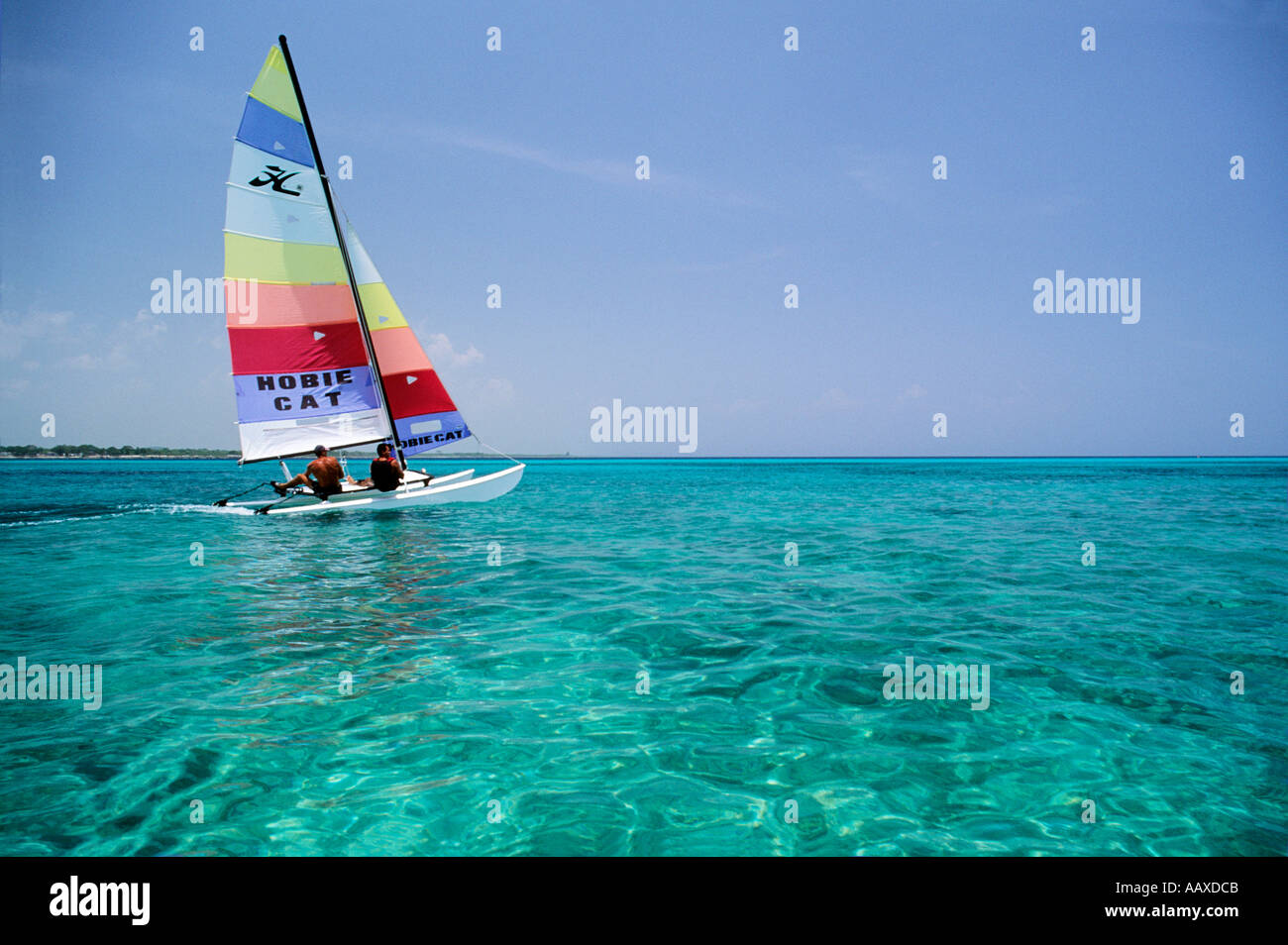 Catamaran Hobie sailing in shallow tropical water Stock Photo - Alamy